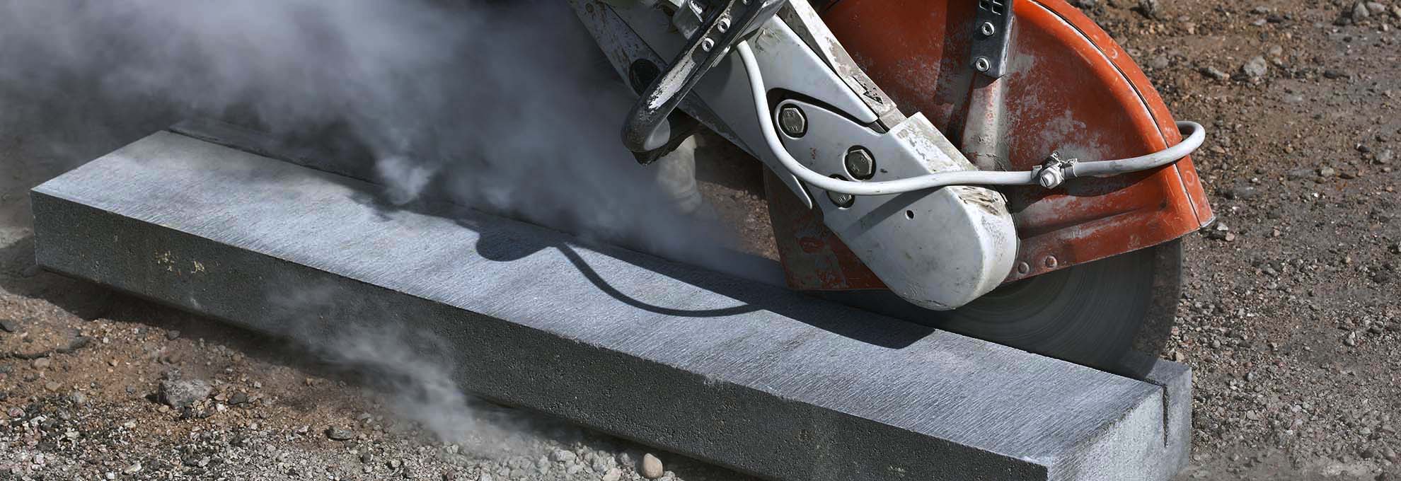 Construction worker cutting concrete curb - Concrete Cutting & Core ...